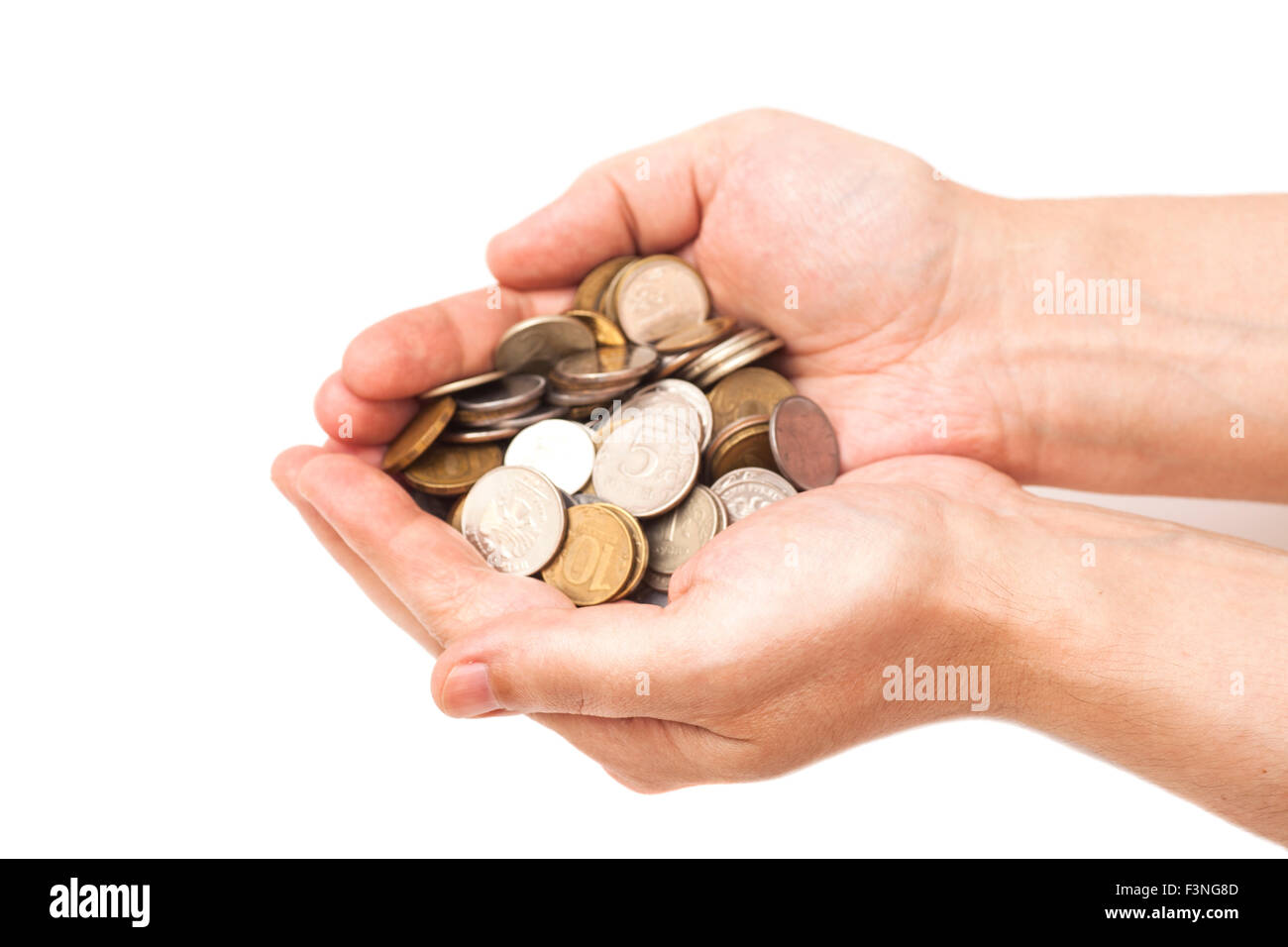 Handful of coins in palm hands isolated on white Stock Photo - Alamy