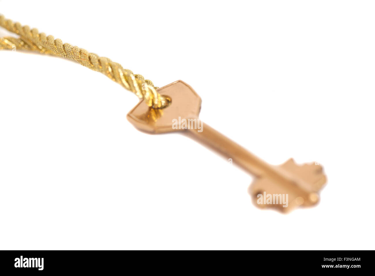 Golden key hanging on gold chain isolated over white Stock Photo - Alamy