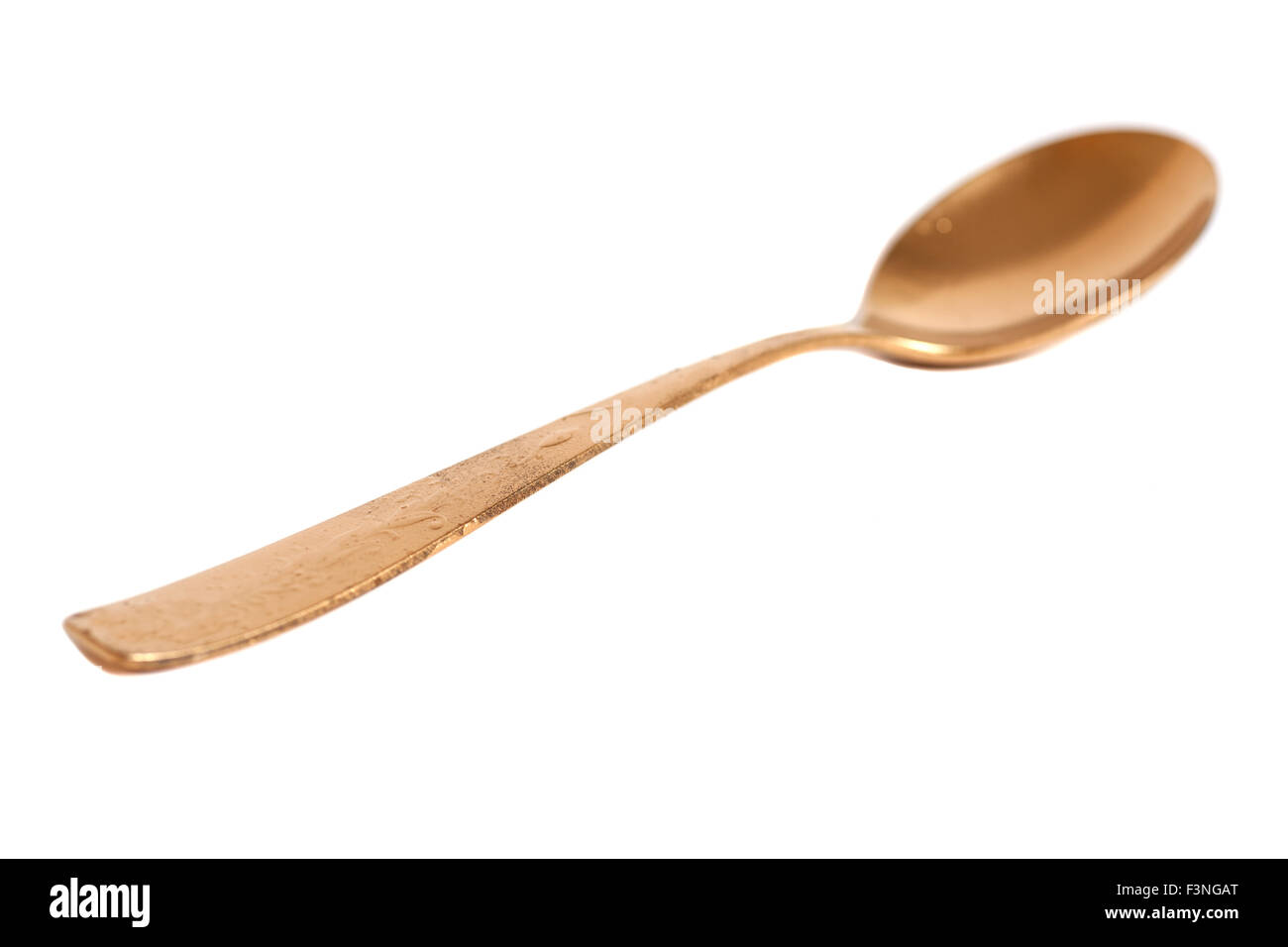 Golden spoon isolated on white Stock Photo - Alamy
