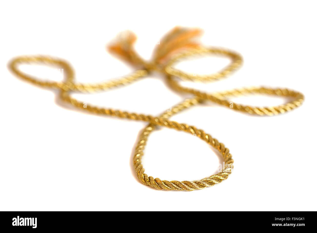 golden rope isolated on white background Stock Photo - Alamy