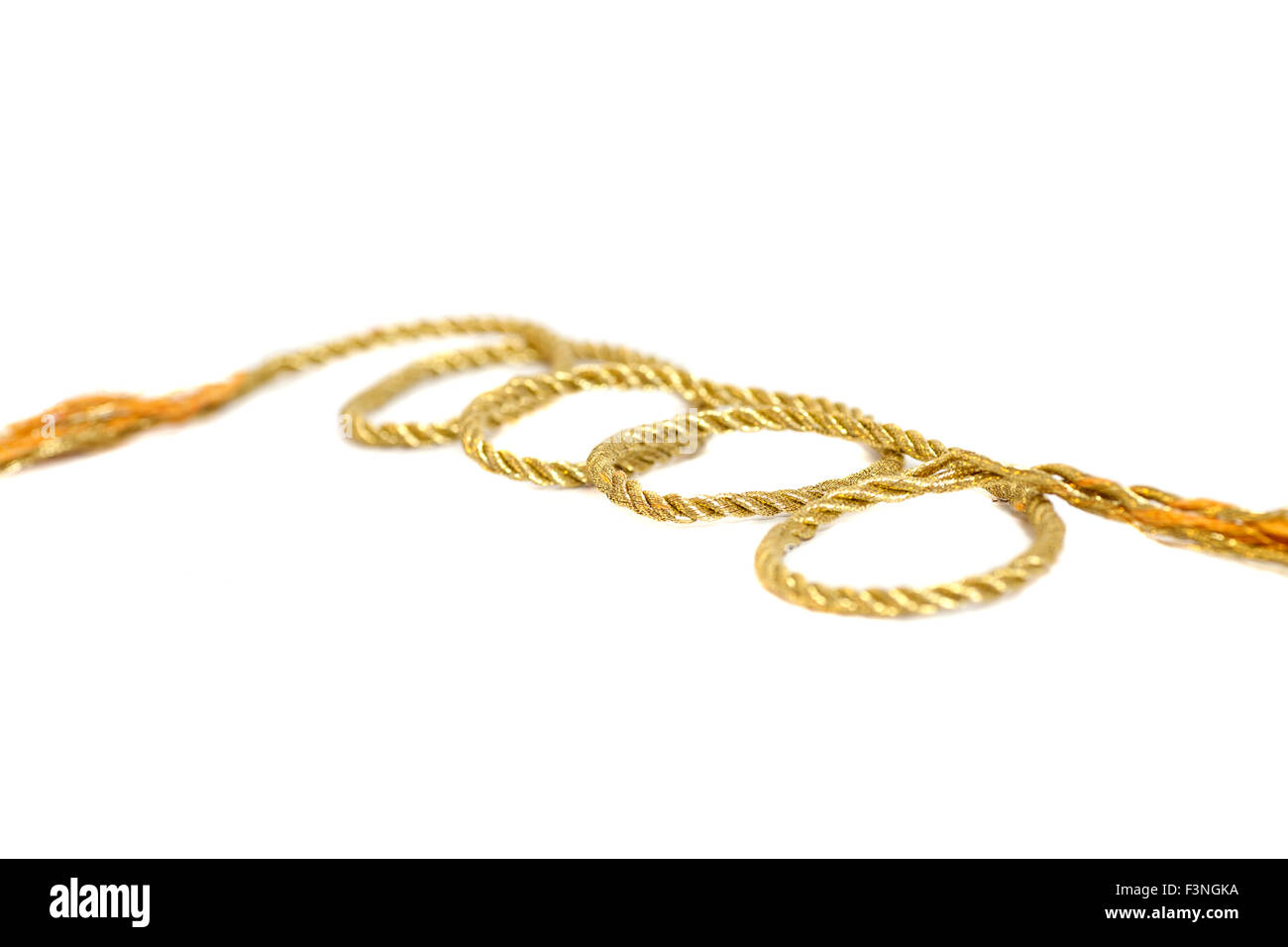 golden rope isolated on white background Stock Photo - Alamy