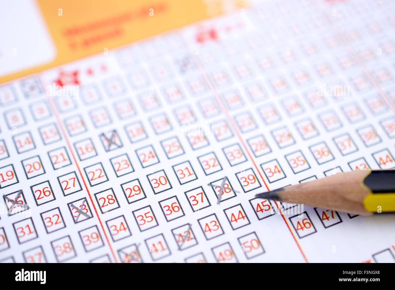 Lottery ticket with ticked numbers Stock Photo - Alamy