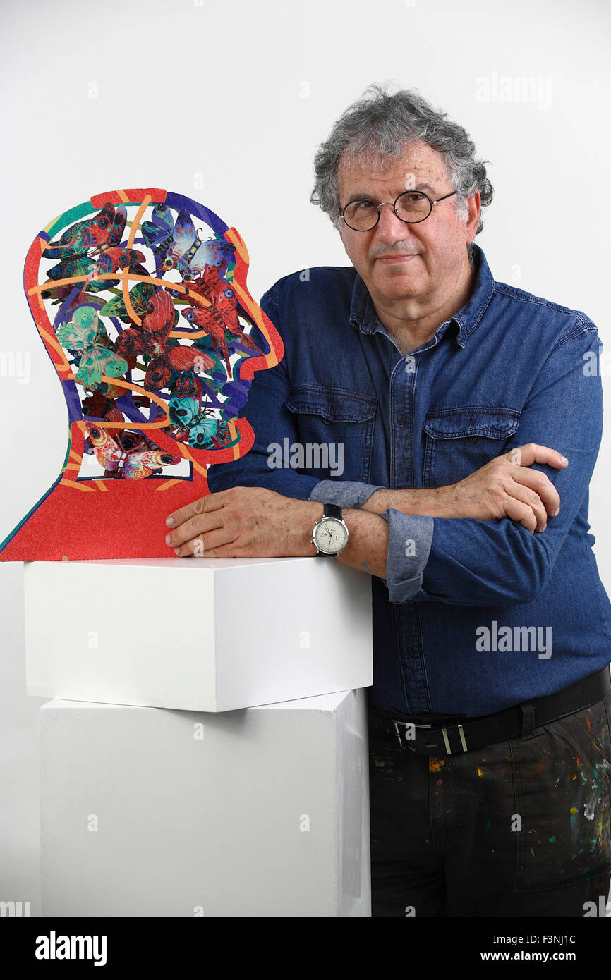 israeli artist David Gerstein showing one of his artwork at his studio ...