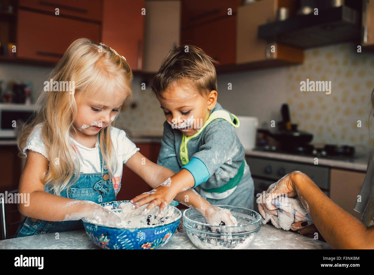 Kids is playing with flour Stock Photo - Alamy