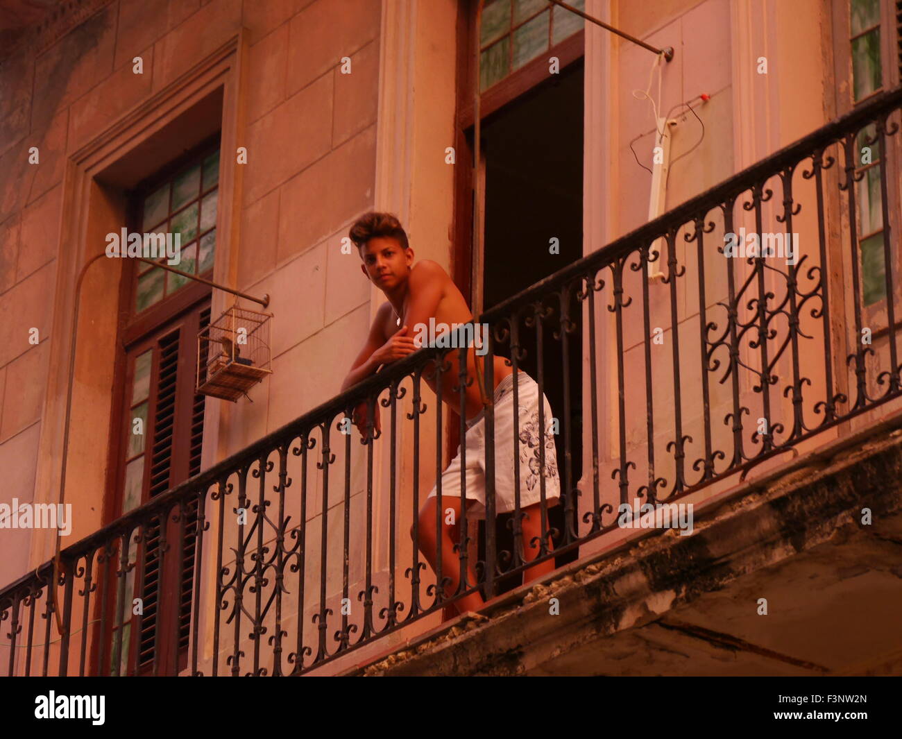 Cuban boy on balcony Stock Photo - Alamy