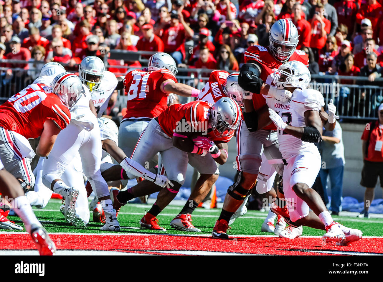 Running back Ezekiel Elliott (15) of the Ohio State Buckeyes dives in ...