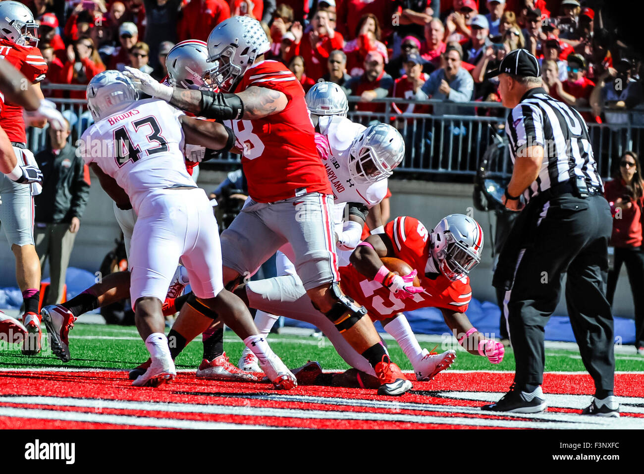 Running back Ezekiel Elliott (15) of the Ohio State Buckeyes dives in ...