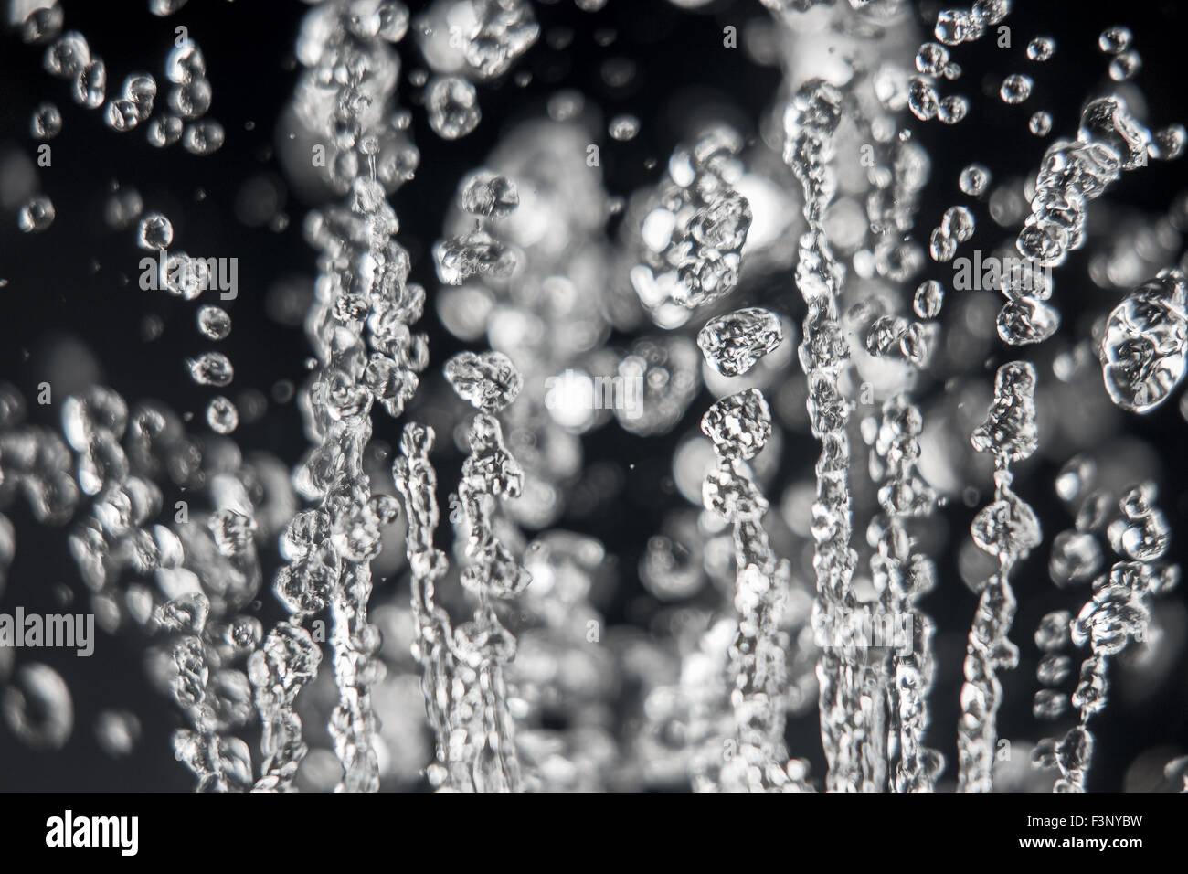 Drops of water levitation on black background, macro image. Frozen ...