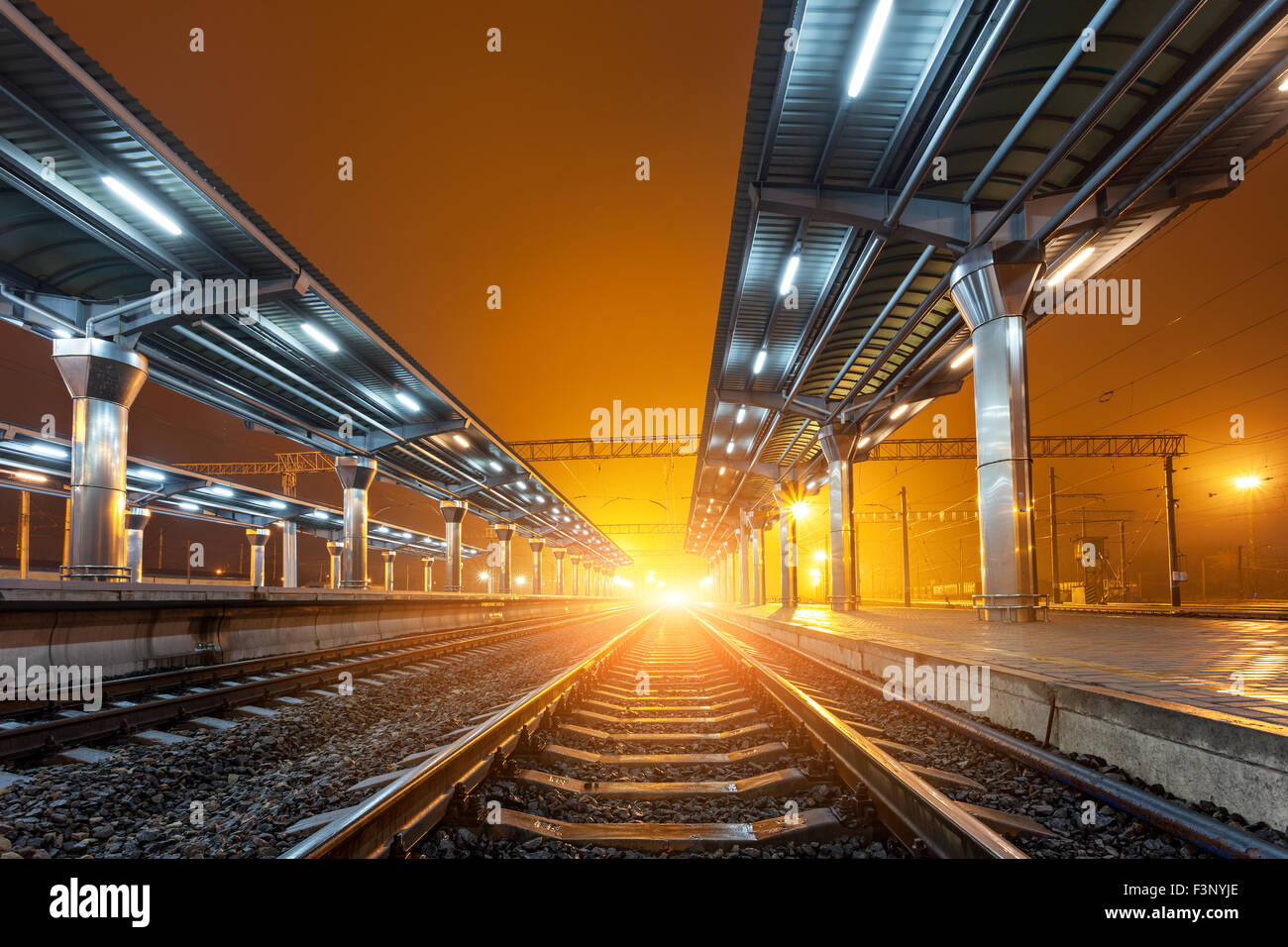 Cargo train platform at night. Railroad in Ukraine. Railway station ...