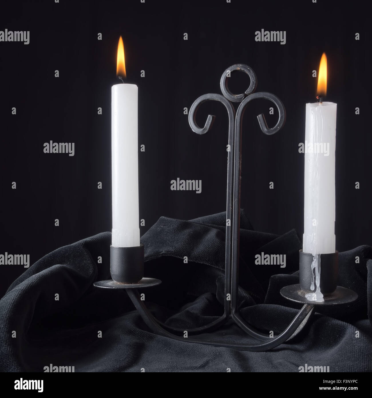 Old, vintage candlestick on velvet. Dark Stock Photo - Alamy