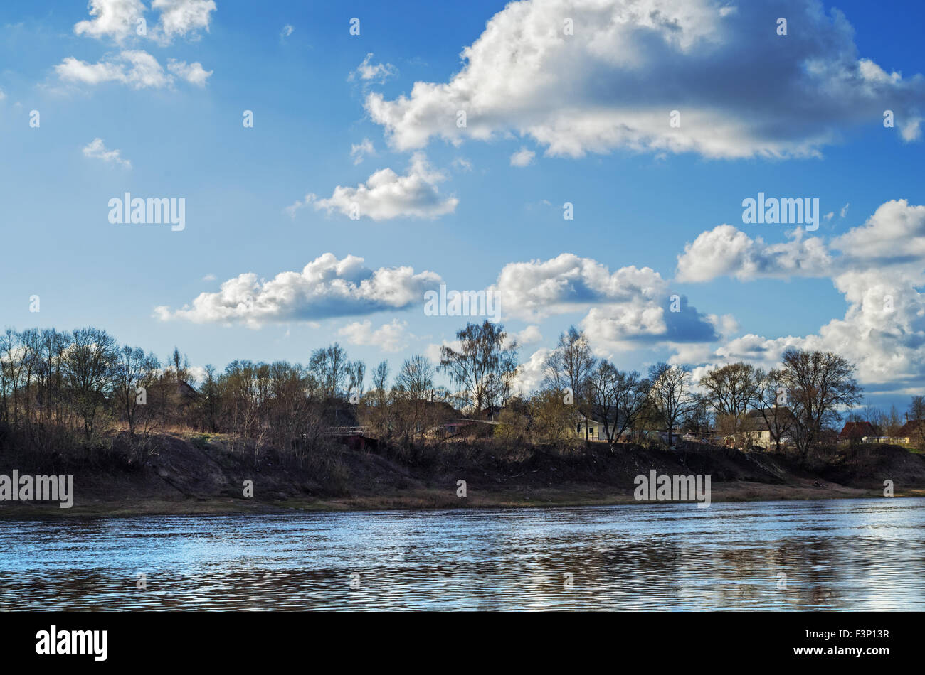 Spring river landscape with white clouds Stock Photo - Alamy