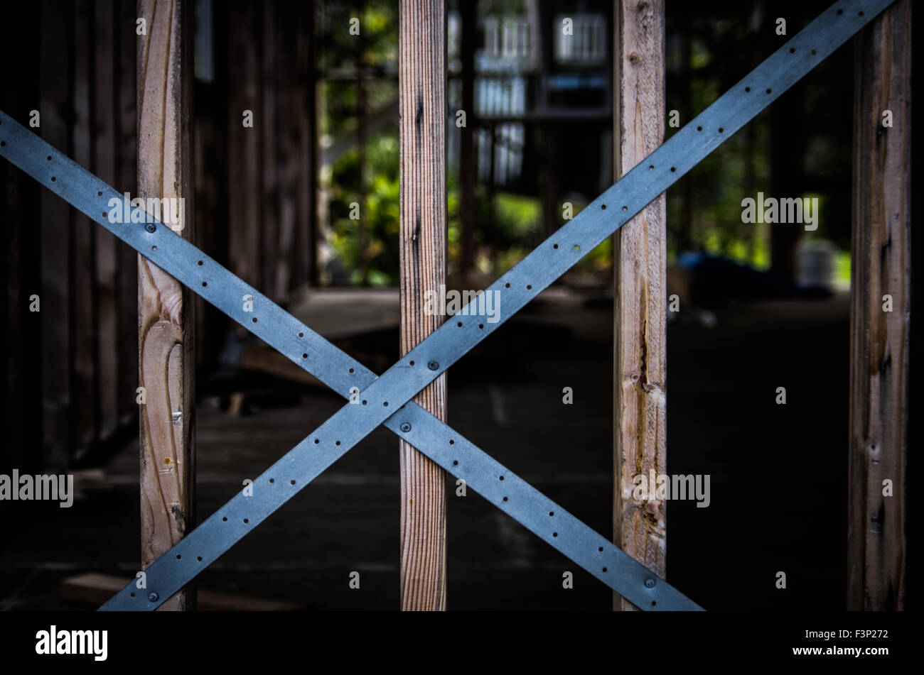 Crossbars of a house under construction. with vertical wood crossbeams ...
