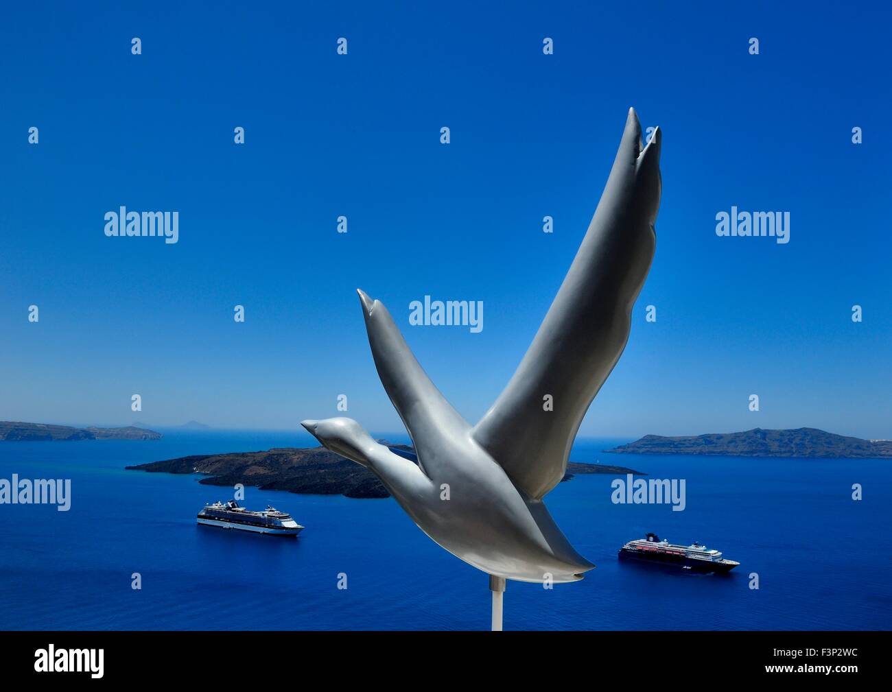 A bird statue looking over the caldera Fira Santorini Greece Stock ...
