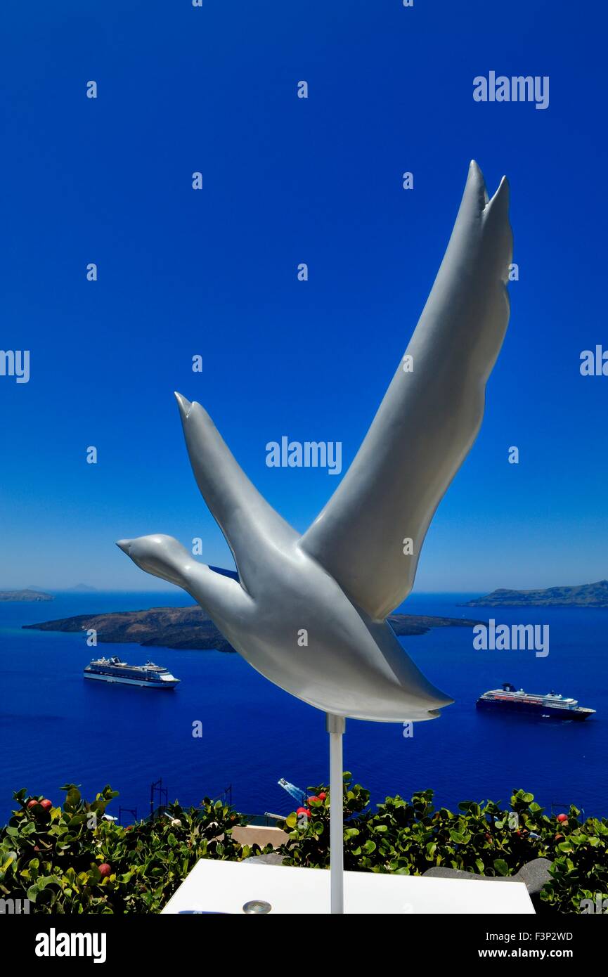 A bird statue looking over the caldera Fira Santorini Greece Stock ...