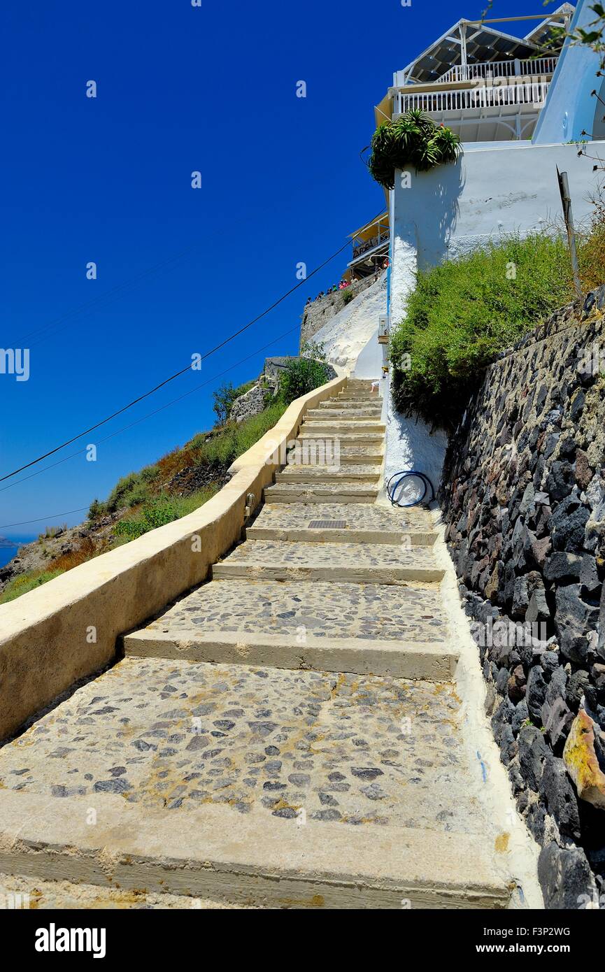 A view looking up a steep path in Fira Santorini Greece Stock Photo - Alamy