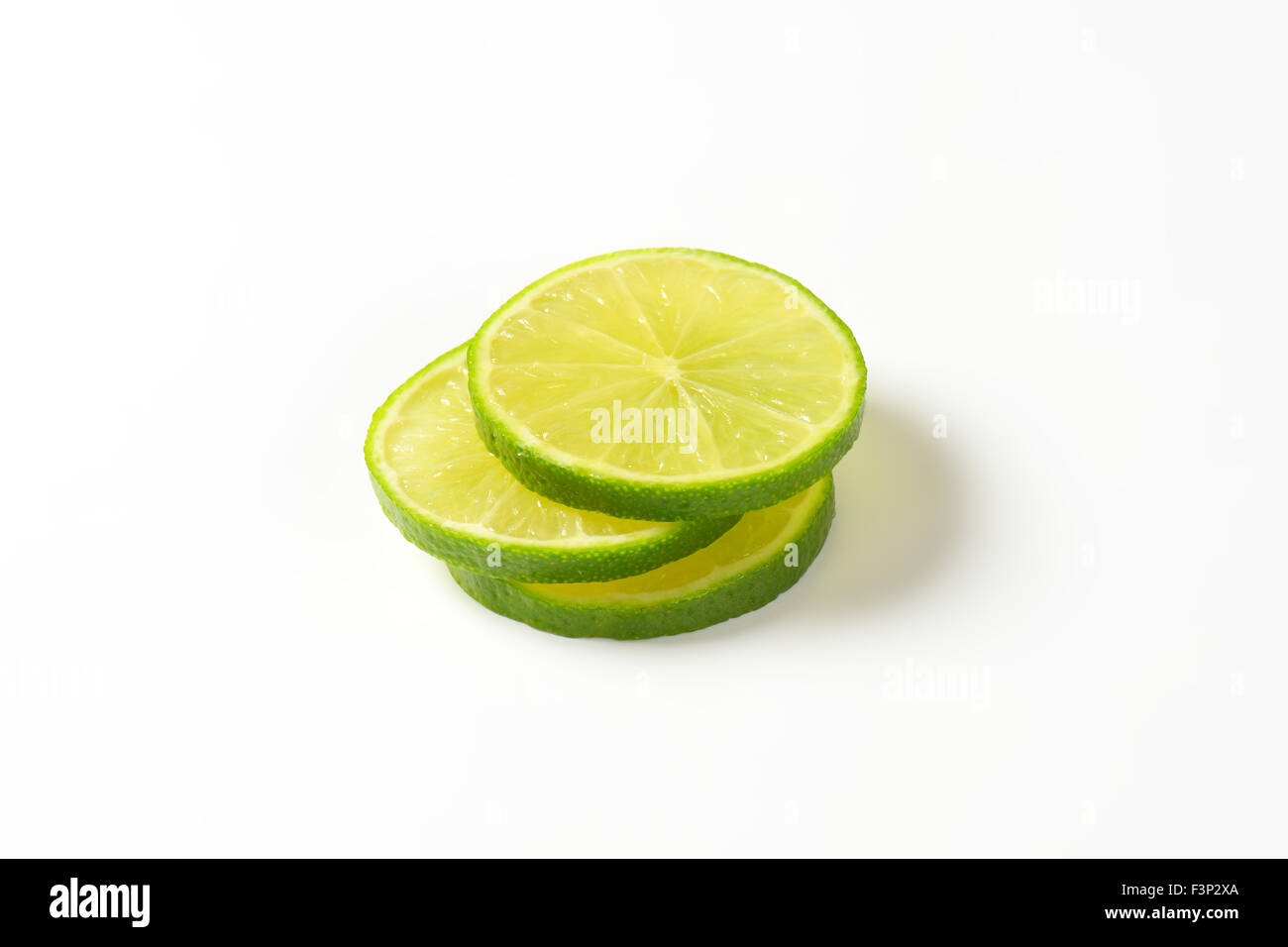 stack of lime slices on white background Stock Photo - Alamy
