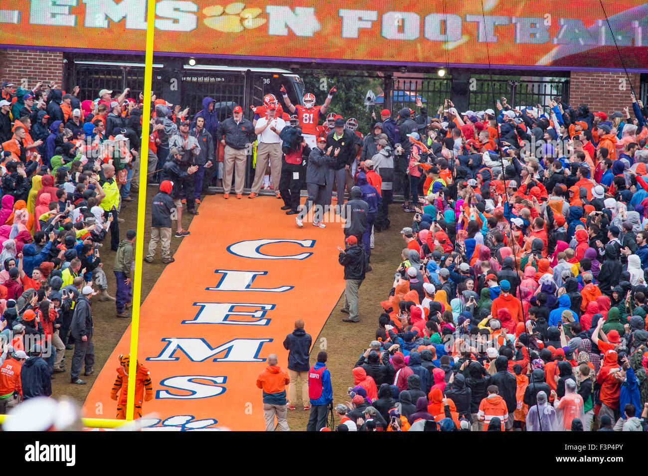 Clemson Tigers head coach Dabo Swinney and players arrive at the top of ...