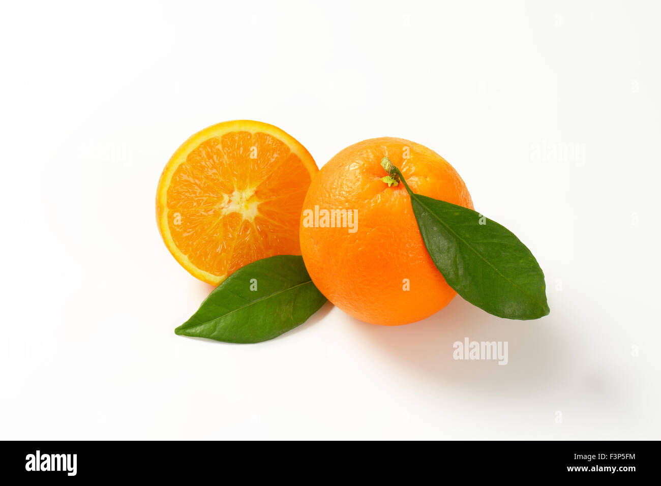 one and half oranges on white background Stock Photo - Alamy