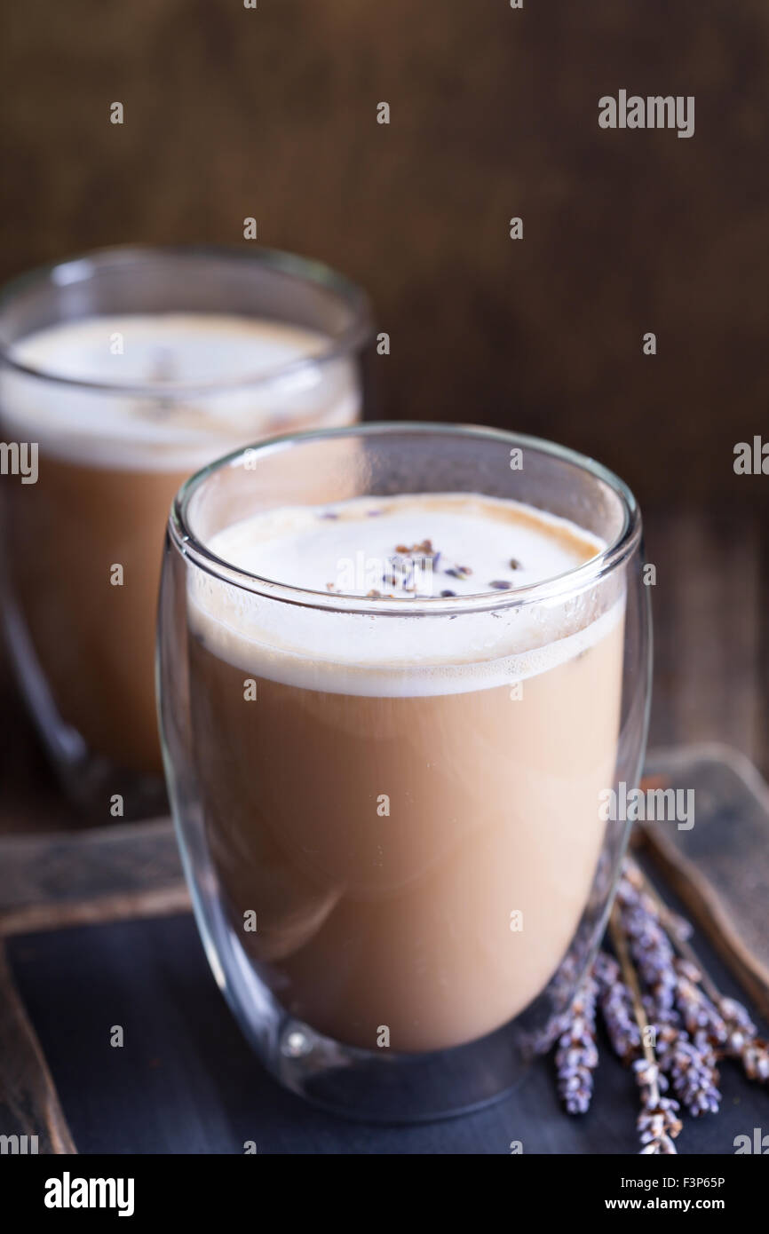 Hot latte in big double wall glasses with dried lavender Stock Photo ...