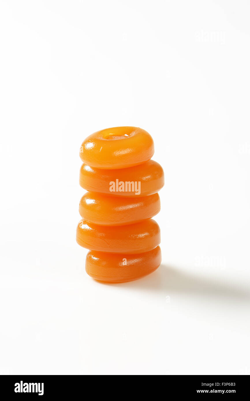 stack of caramel candies on white background Stock Photo - Alamy
