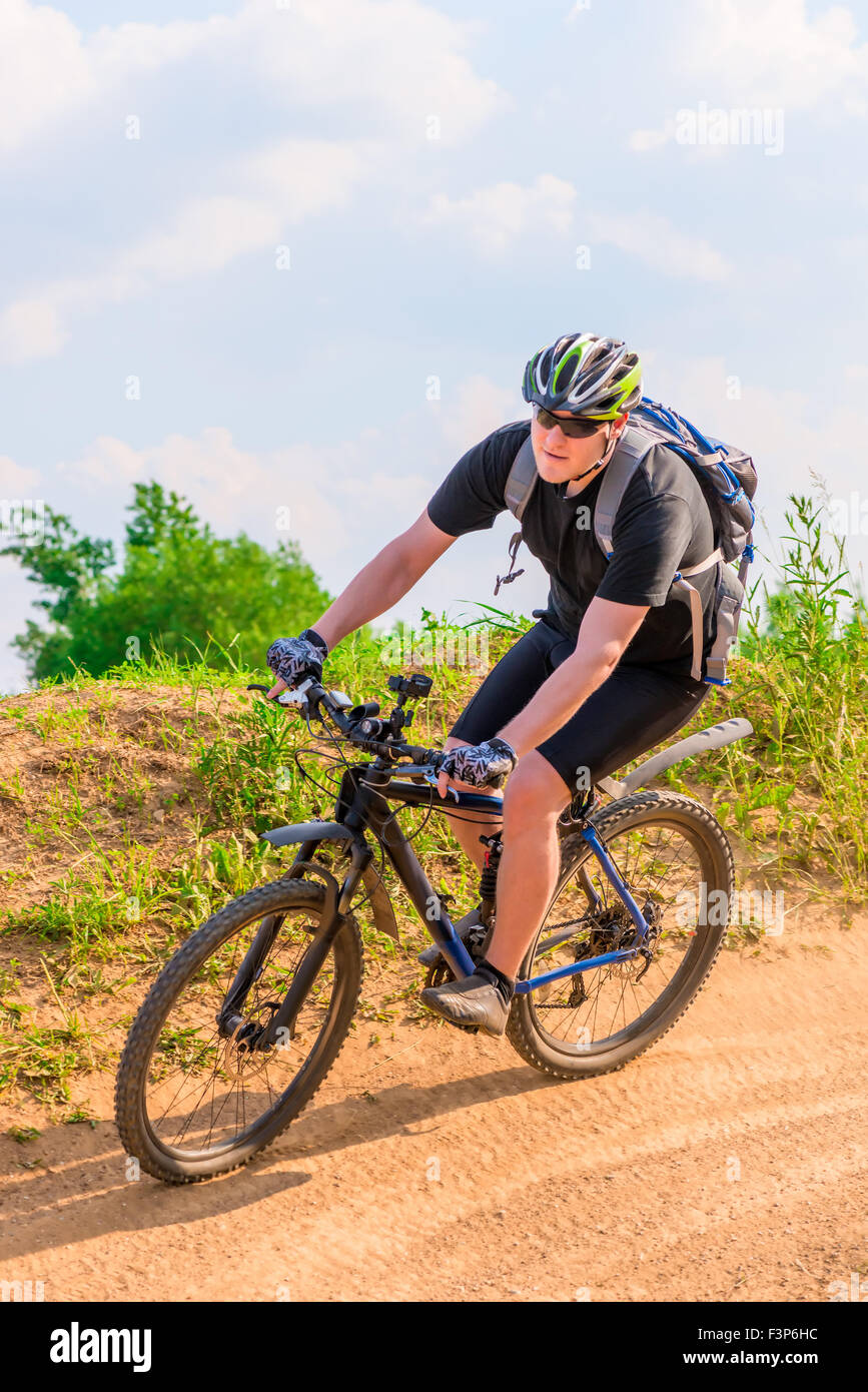 Wearing helmet on bike hi-res stock photography and images - Alamy