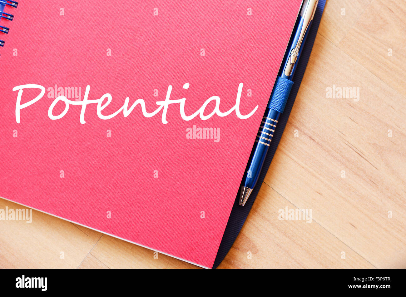 Notepad and pen on wooden background and text concept Stock Photo - Alamy