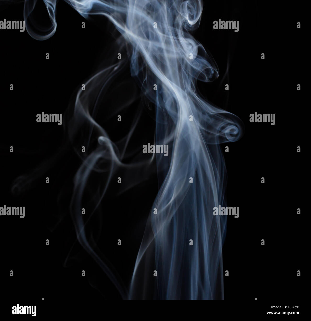 Abstract white floating smoke on dark background Stock Photo - Alamy