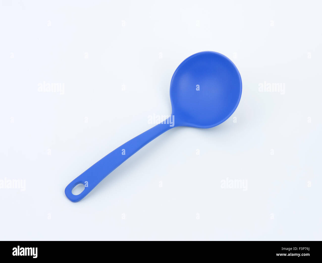 blue ladle on white background Stock Photo - Alamy
