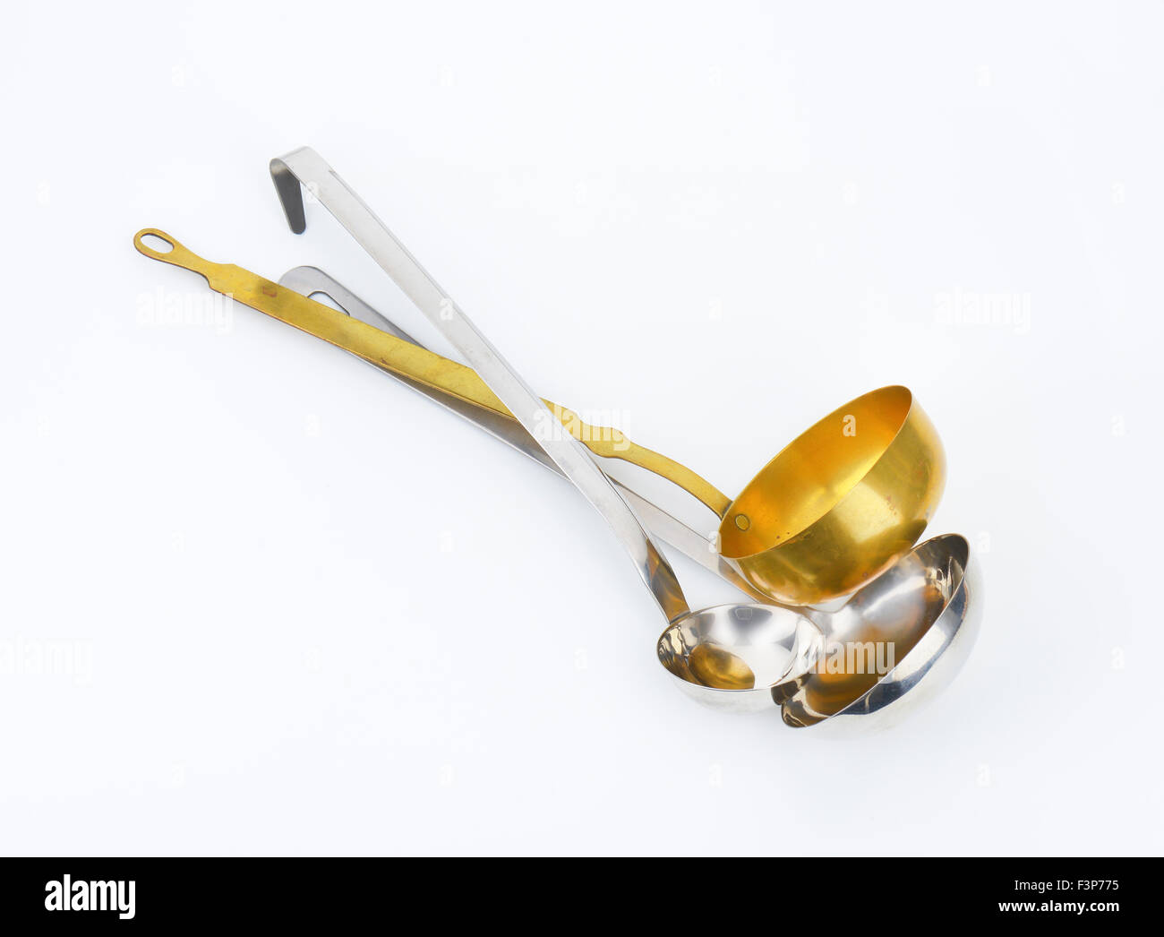 three soup ladles on white background Stock Photo - Alamy