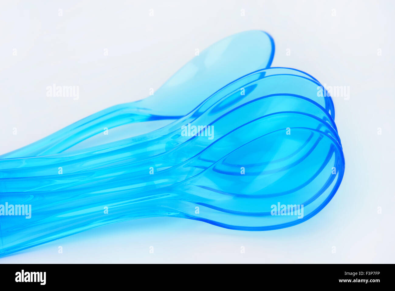bunch of turquoise tea spoons on white background Stock Photo - Alamy