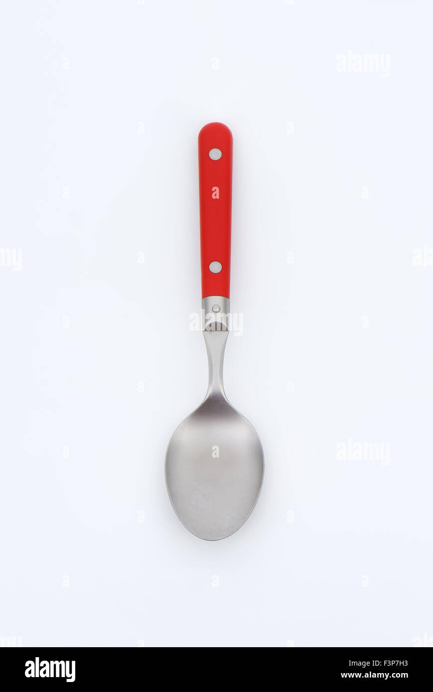 empty spoon with red wooden handle on white background Stock Photo - Alamy