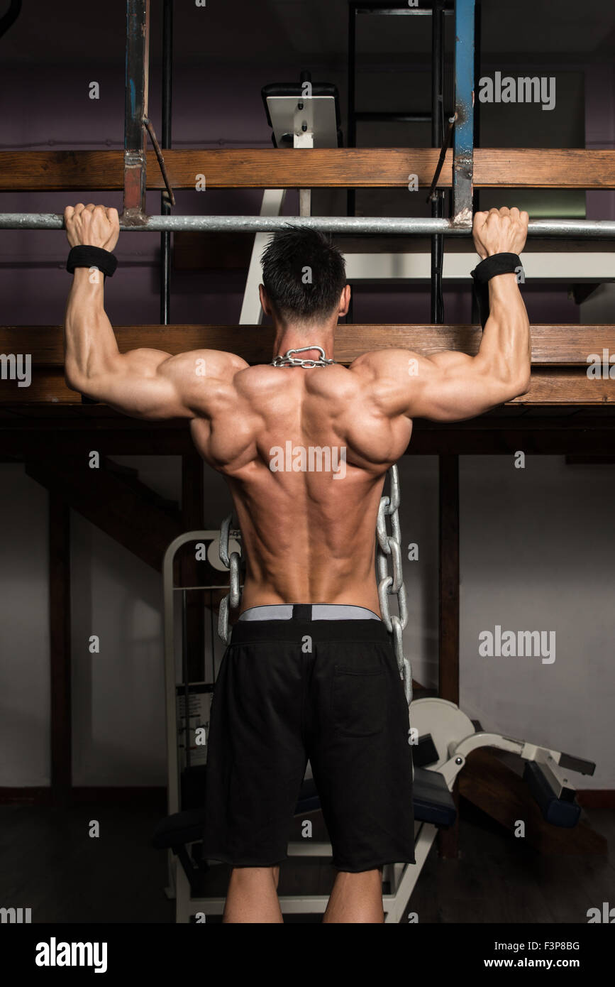 Bodybuilder Doing Heavy Weight Exercise For Back With Chains Stock ...