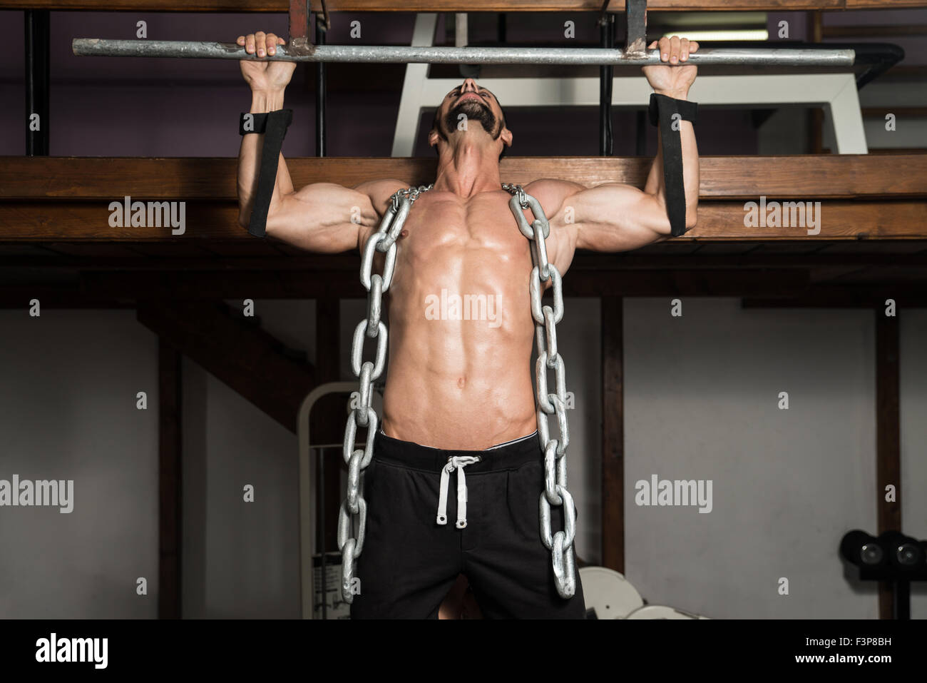 Bodybuilder Doing Heavy Weight Exercise For Back With Chains Stock ...