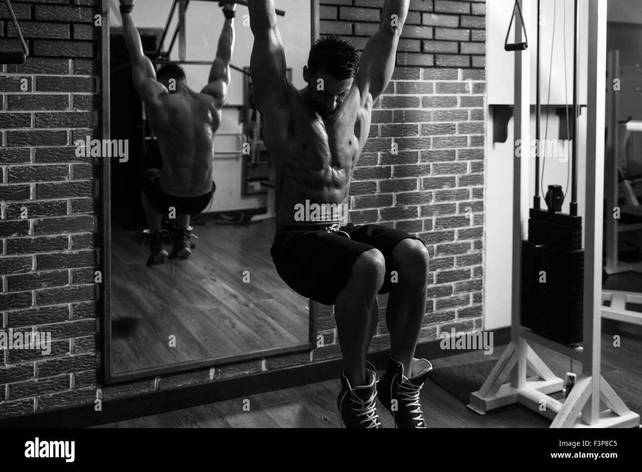 Fit man exercising abs Black and White Stock Photos & Images - Alamy