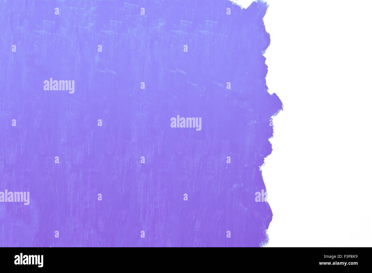 Painting a wall using a roller with purple paint Stock Photo - Alamy