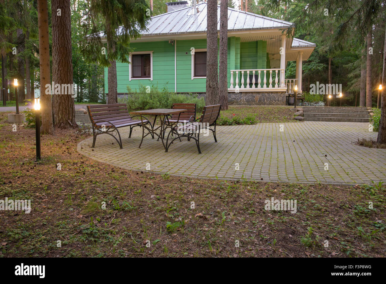 Wooden house illuminated at night Stock Photo - Alamy