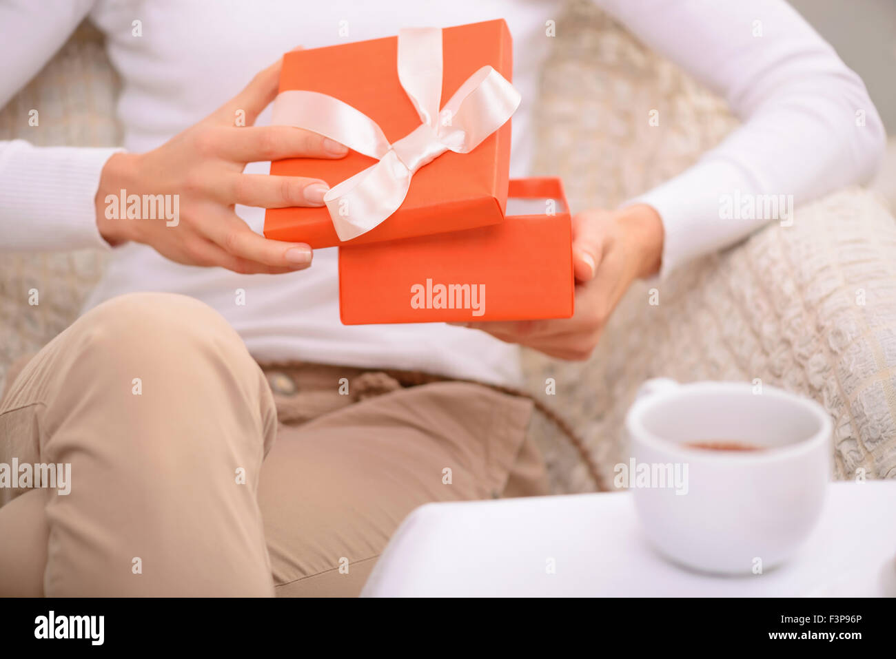 Nice man holding present Stock Photo - Alamy
