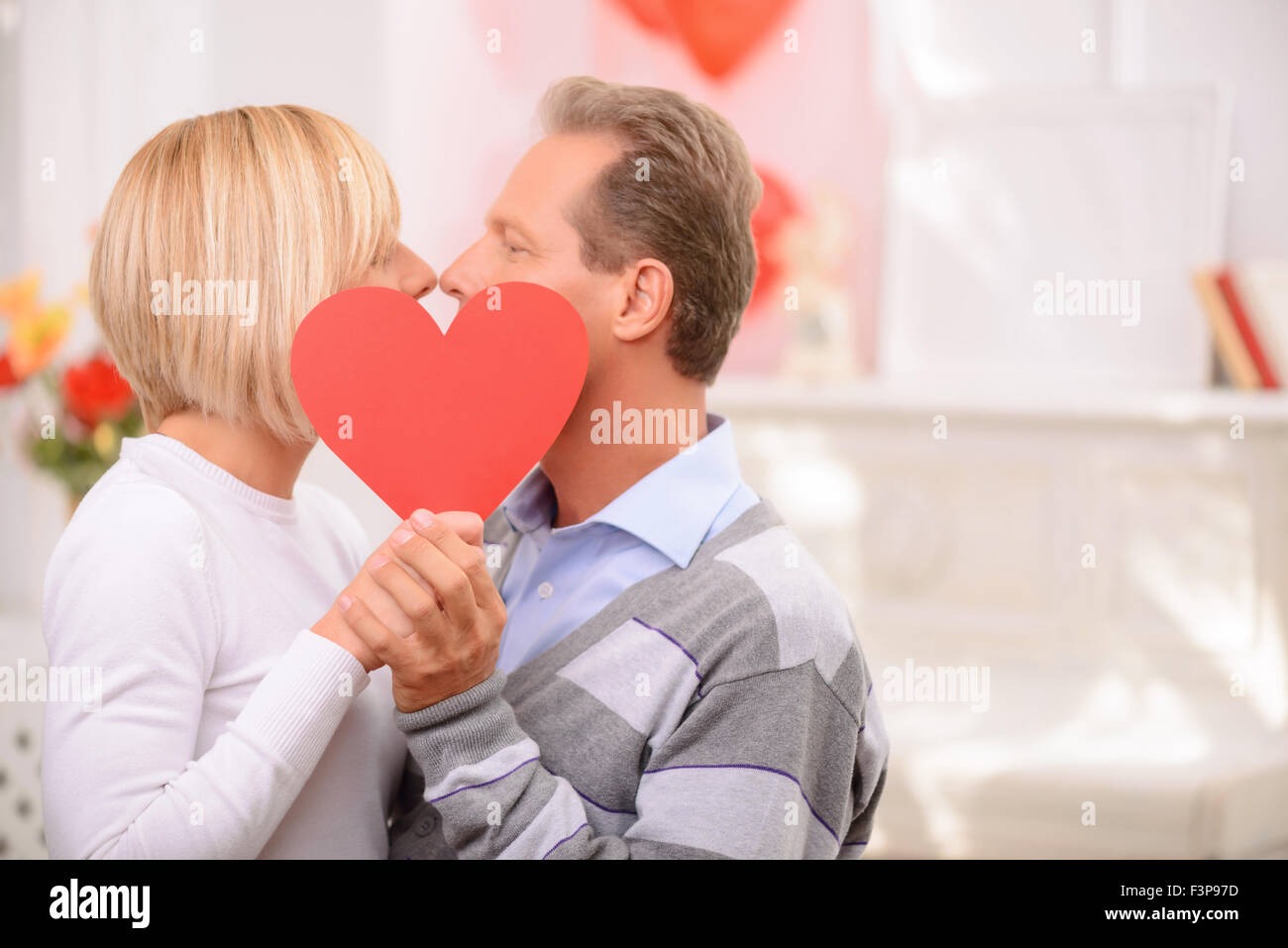 Agreeable couple celebrating St Valentine day Stock Photo - Alamy