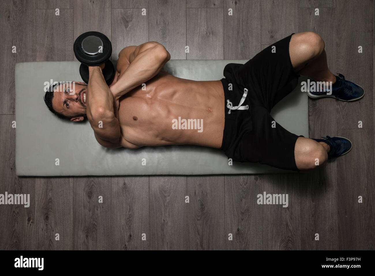 Healthy Athlete Exercising Triceps On Foor As Part Of Bodybuilding ...