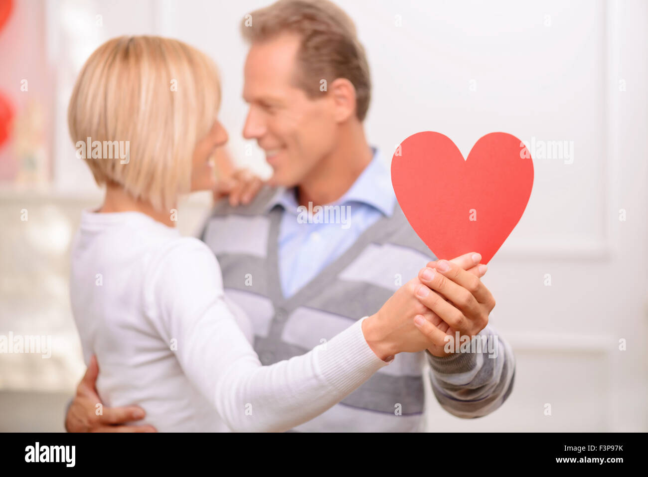 Agreeable couple celebrating St Valentine day Stock Photo - Alamy