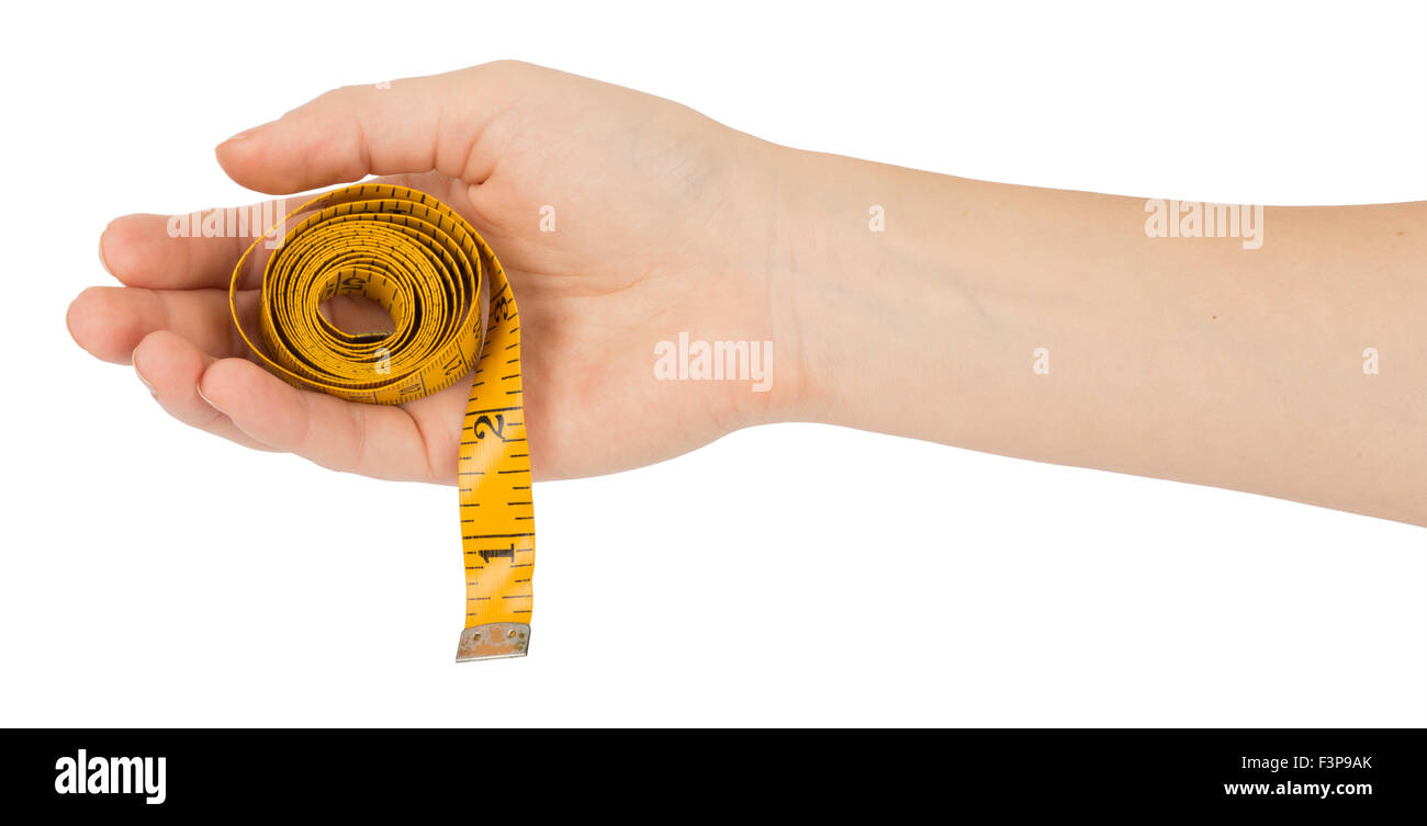 Humans arm holding tape measure Stock Photo - Alamy