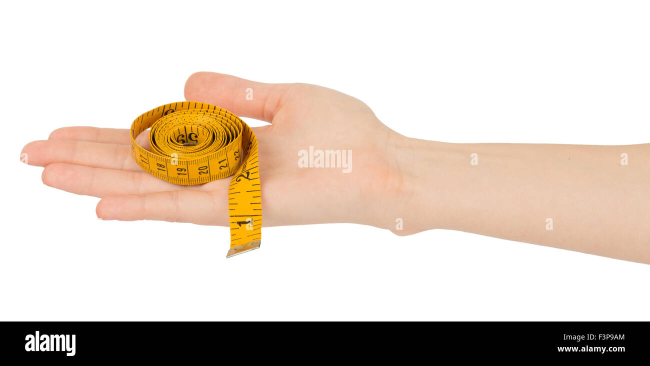 Humans hand holding tape measure Stock Photo - Alamy
