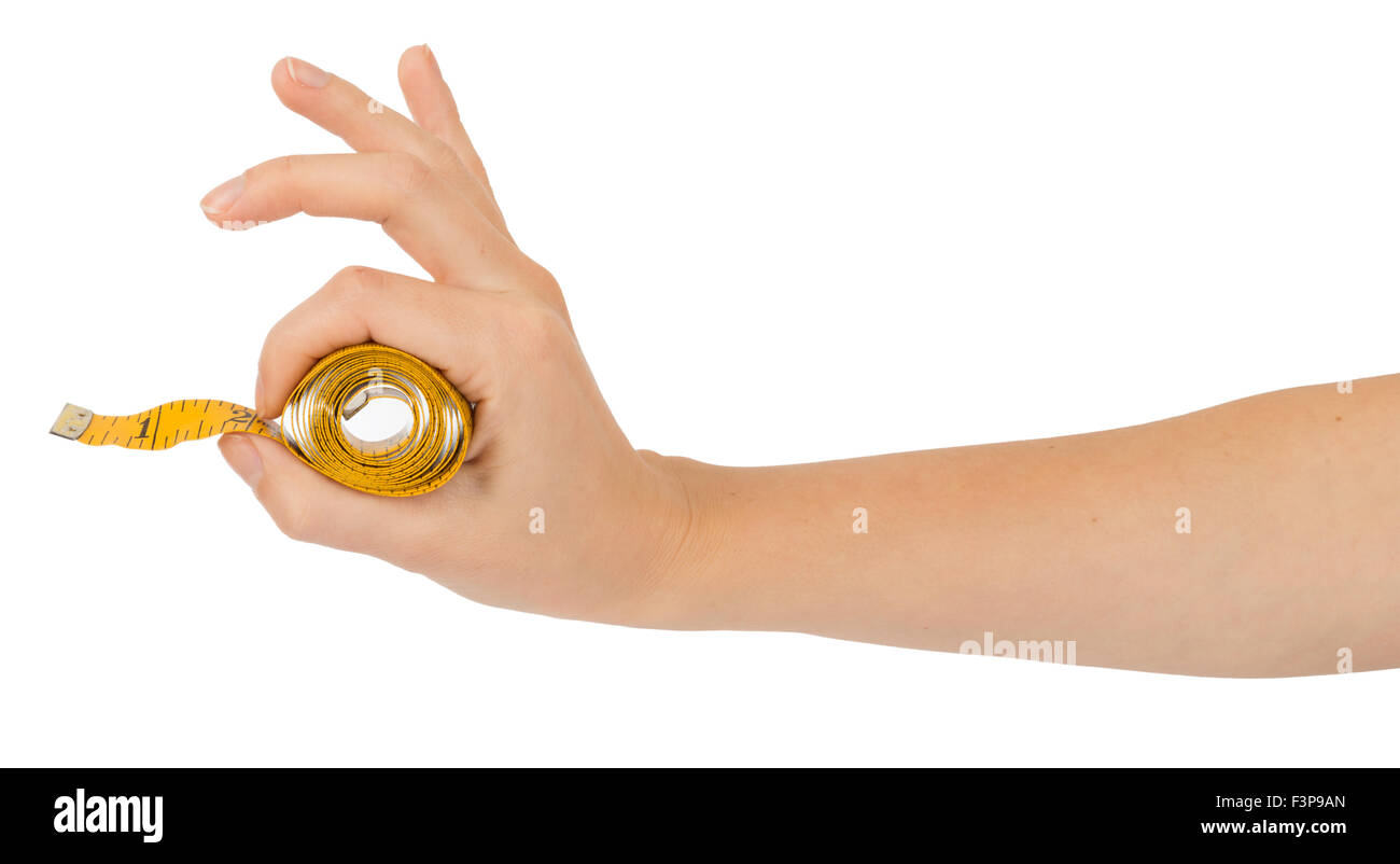 Humans hand holding yellow tape measure Stock Photo - Alamy