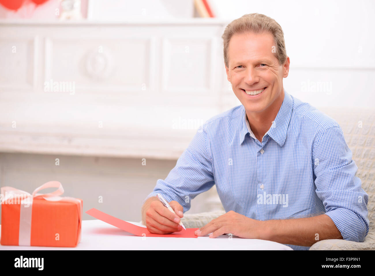 Adult man writing a letter Stock Photo - Alamy