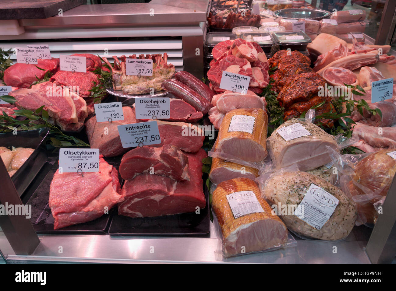 Meat in the cold counter at the butcher's at Torvehallerne, the covered ...