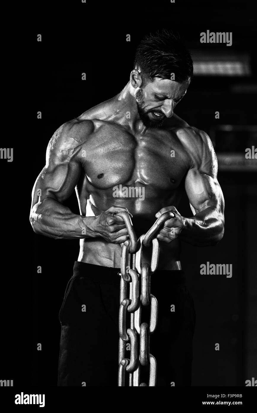 Healthy Bodybuilder Exercising Biceps With Chains Stock Photo - Alamy