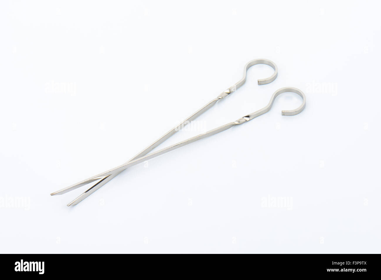 two metal skewers on white background Stock Photo - Alamy