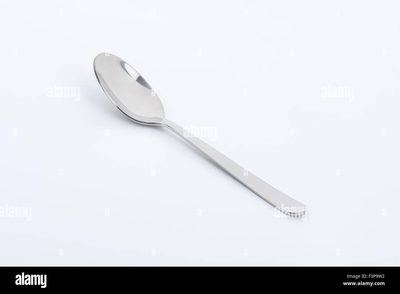 empty spoon on white background Stock Photo - Alamy