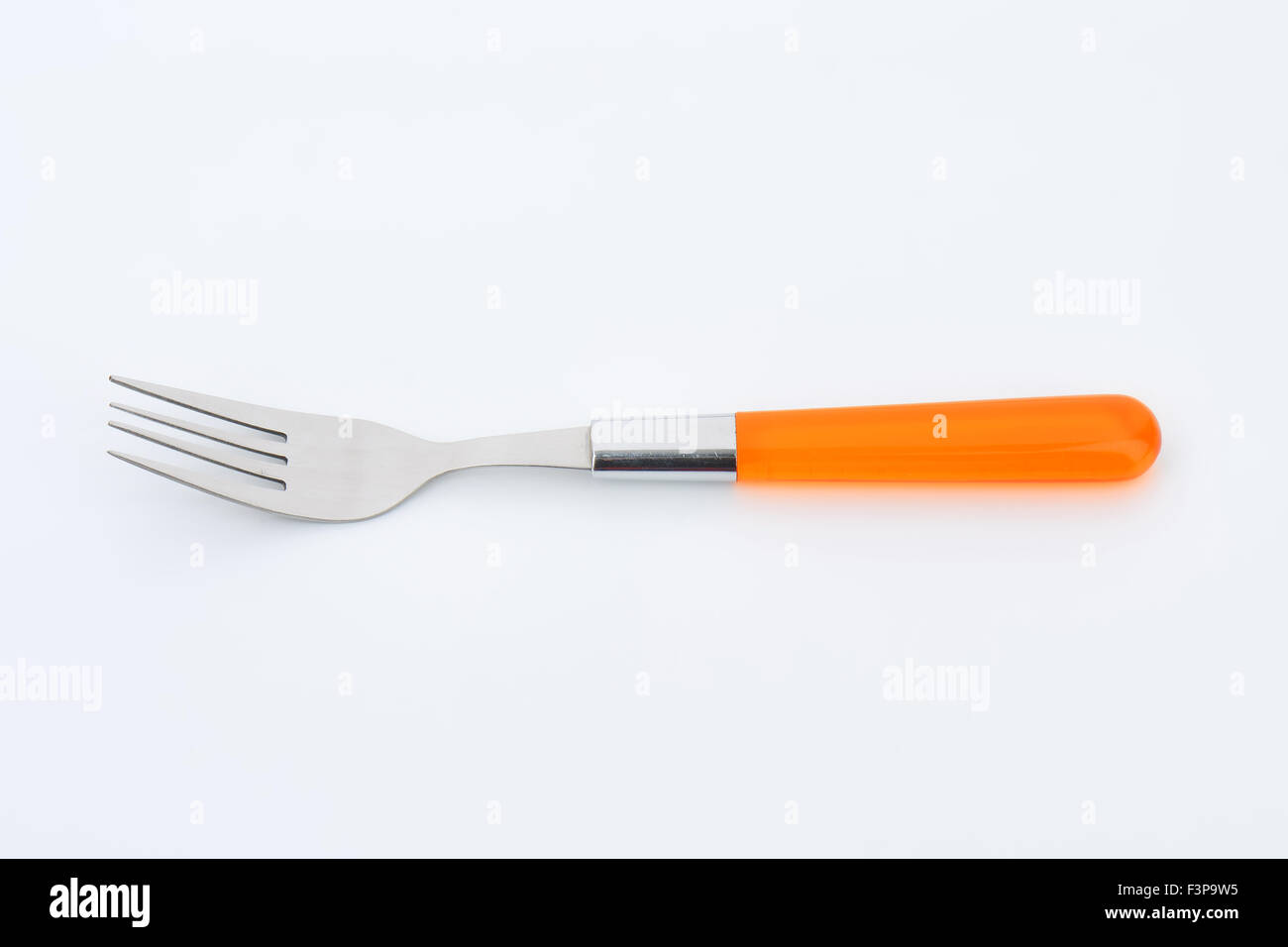 empty fork with orange handle on white background Stock Photo - Alamy