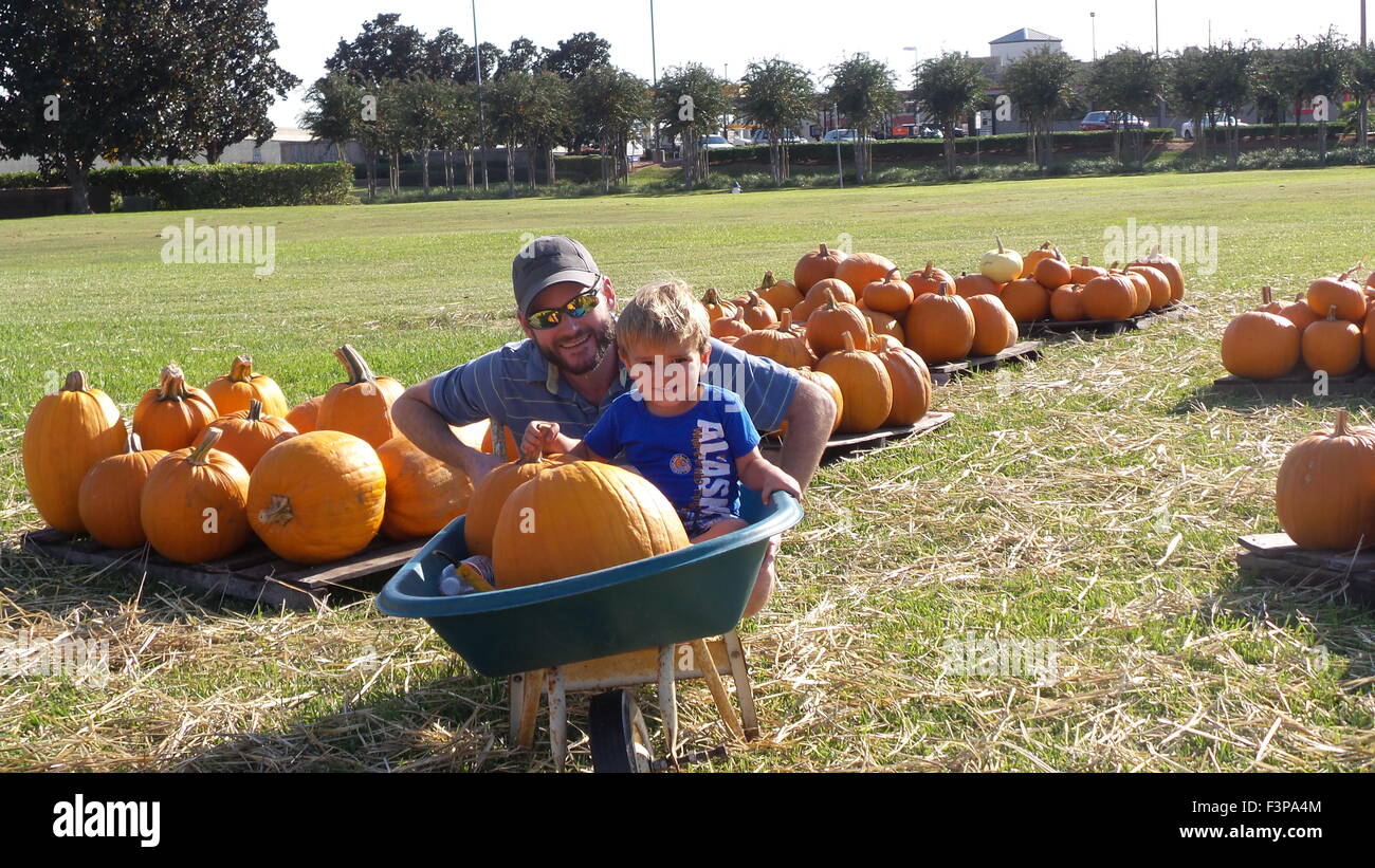 Houston, USA. 10th Oct, 2015. A man and his son pose with a pumpkin for ...